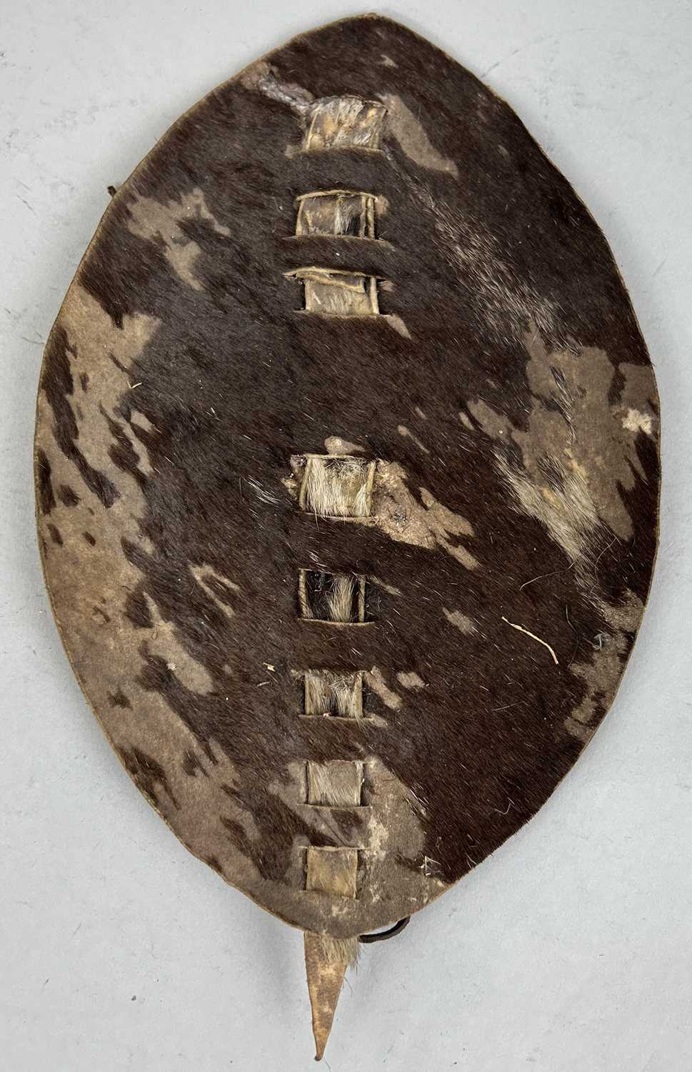 Lot 474 - A TRIBAL ANIMAL HIDE SHIELD FROM THE