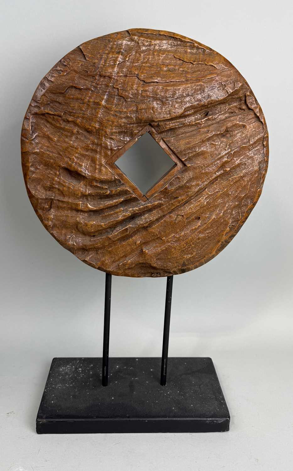 Lot 674 - A WOODEN DISC SCULPTURE