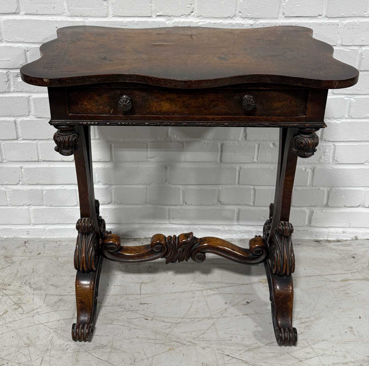 Lot 855 - AN ANTIQUE POLLARD OAK SIDE TABLE WITH WAVE