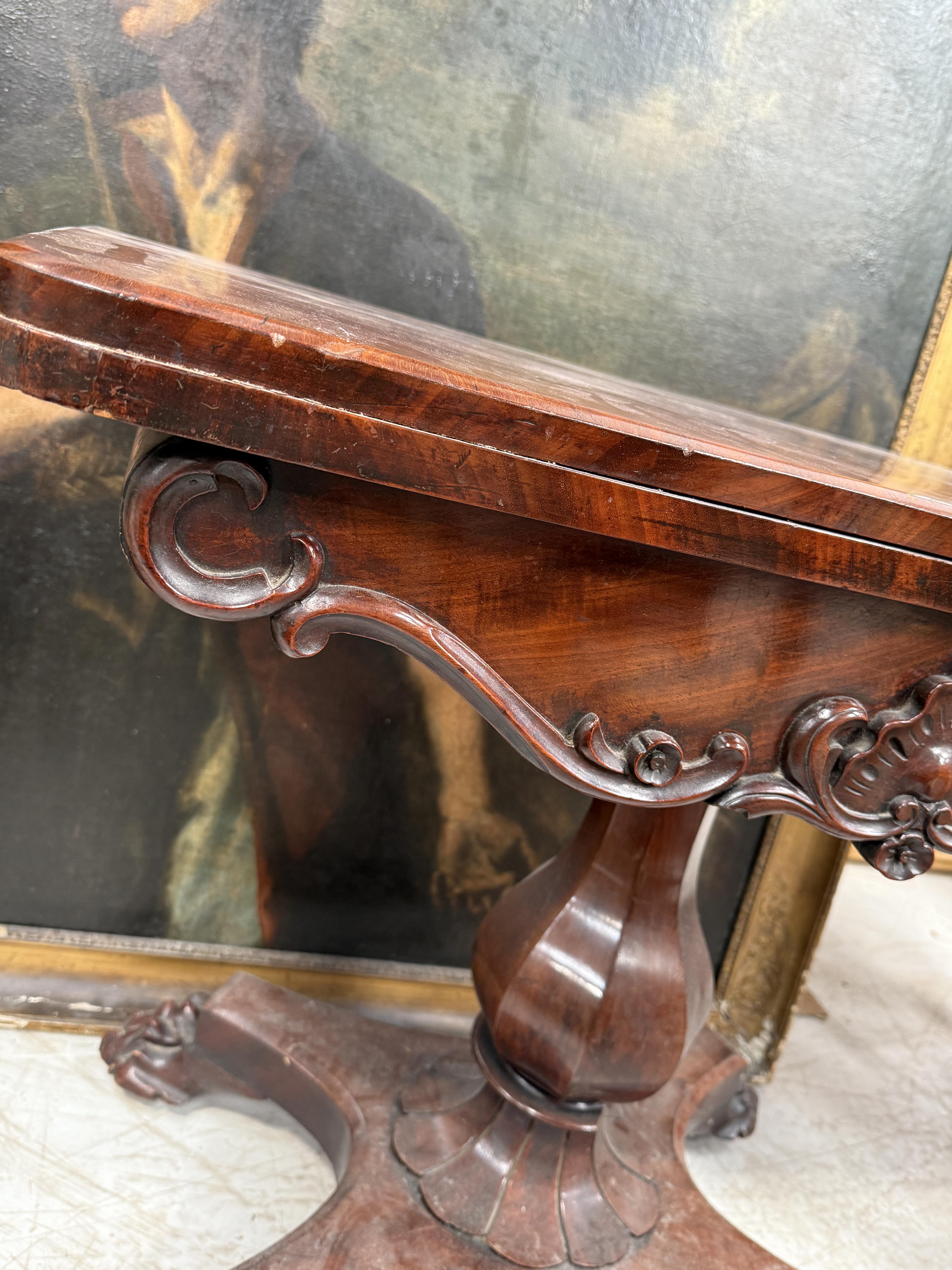 Lot 823 - WILLIAM IV: A CARD TABLE WITH LION PAW FEET