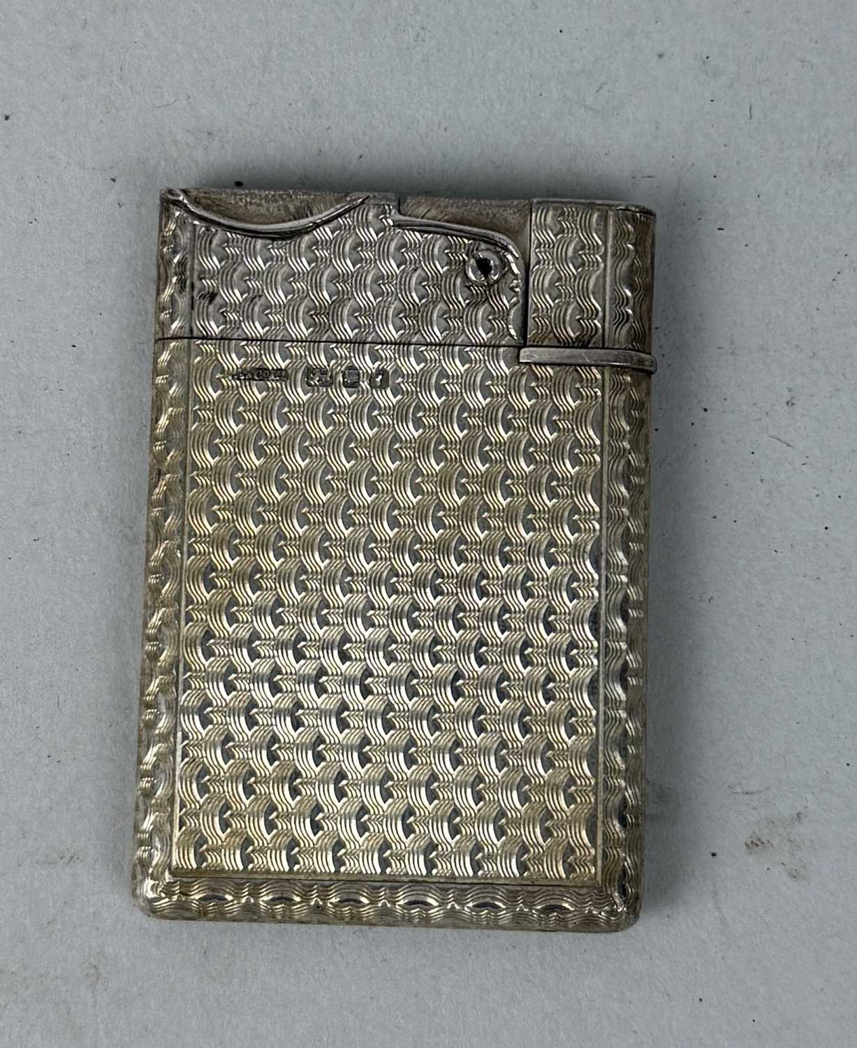 Lot 115 - A SILVER CIGARETTE LIGHTER