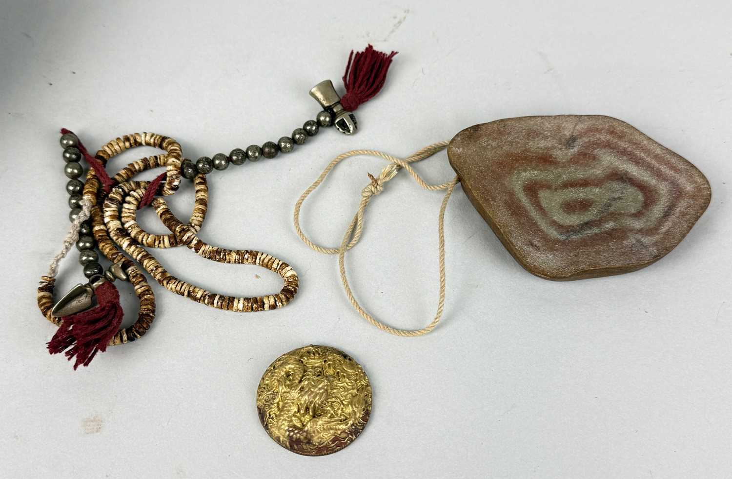 Lot 217 - CHINESE RED STONE AND A GILT METAL DRAGON