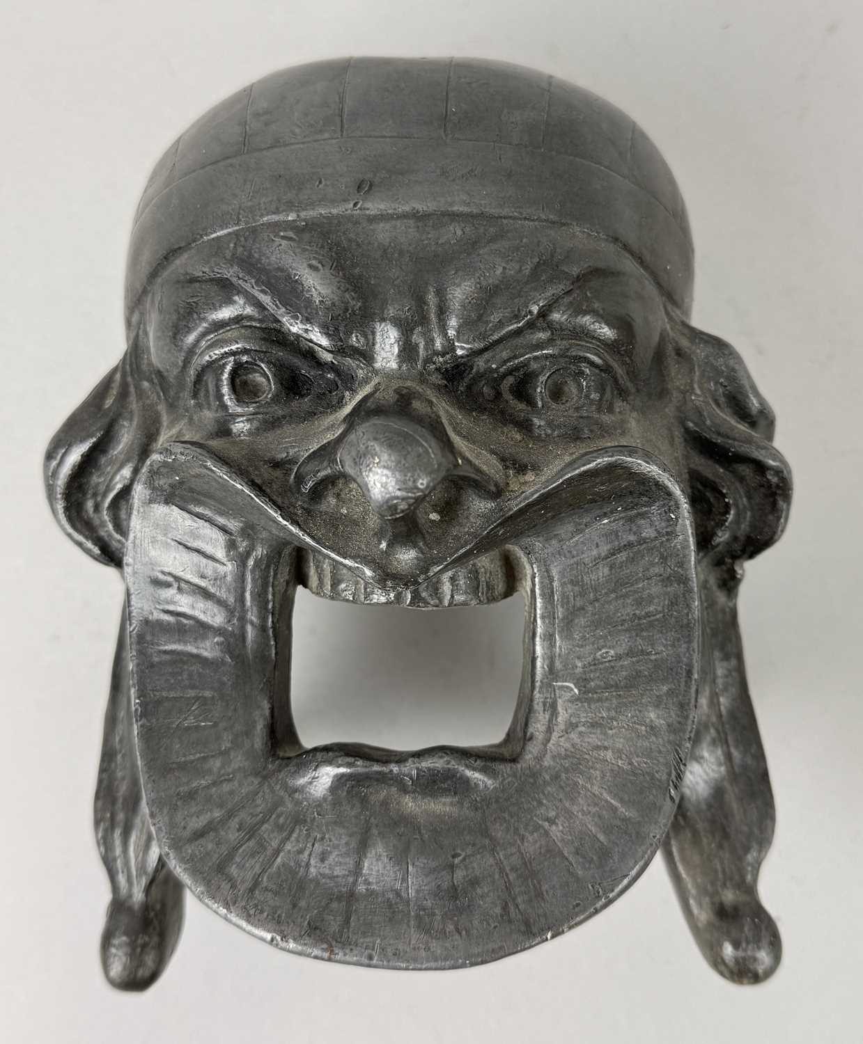 Lot 428 - AN UNUSUAL HEAVY CAST METAL WALL MASK IN THE