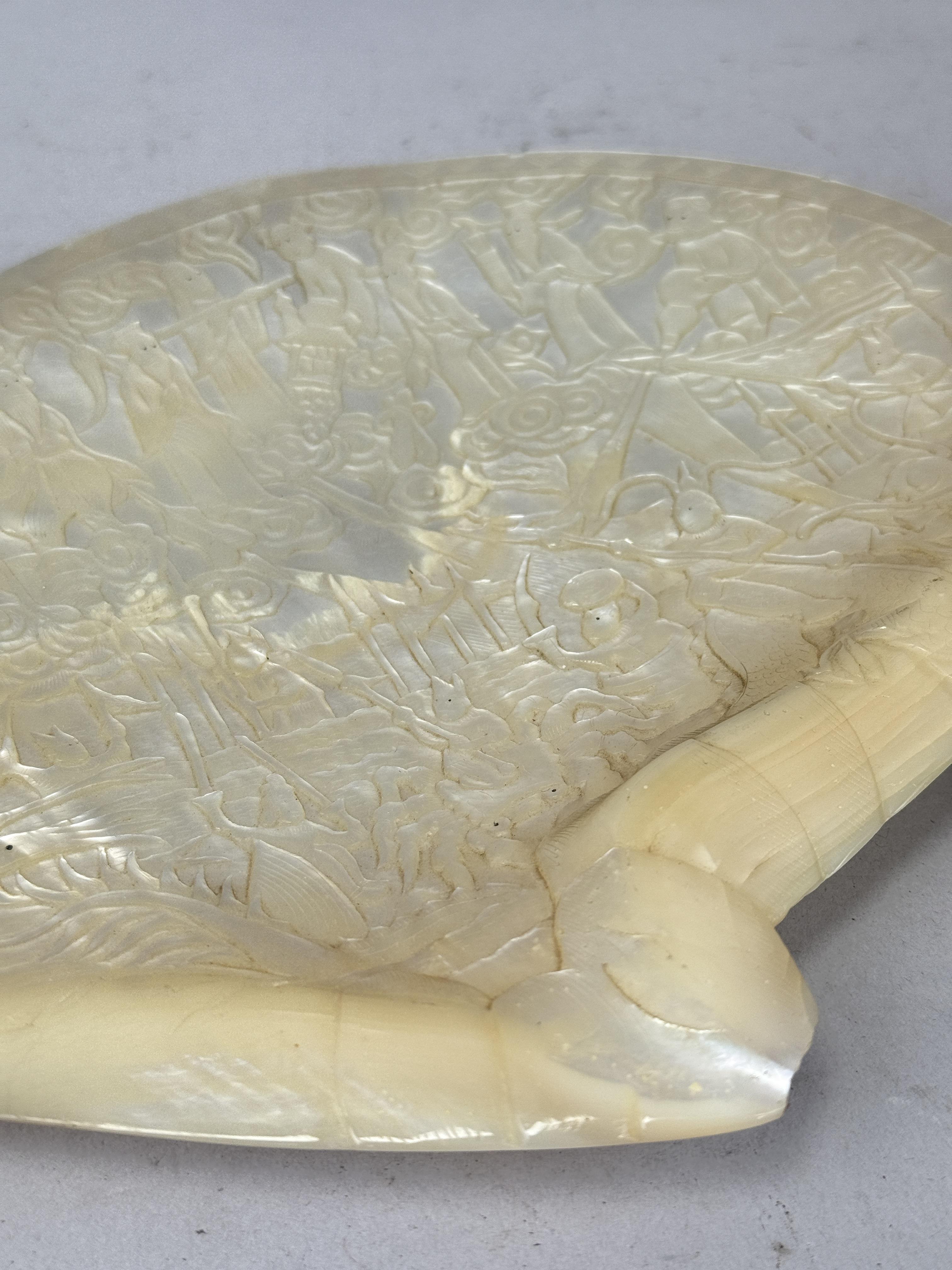 Lot 301 - A CHINESE MOTHER OF PEARL CARVED SHELL WITH